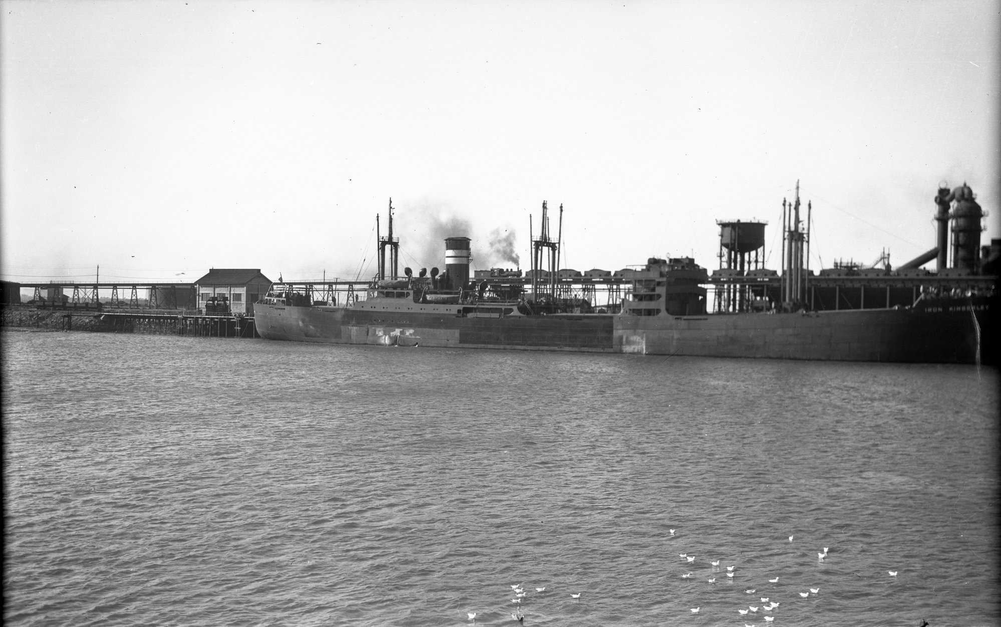 BHP Ship "S.S. Iron Kimberley" with BHP Steam Locomotive on jetty ...