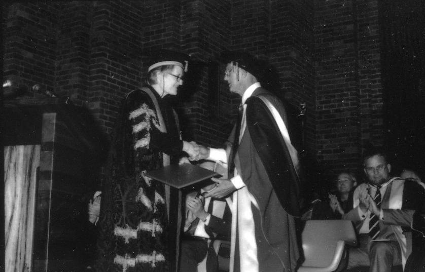 Chancellor, Elizabeth Evatt presents a graduate with his award in the ...