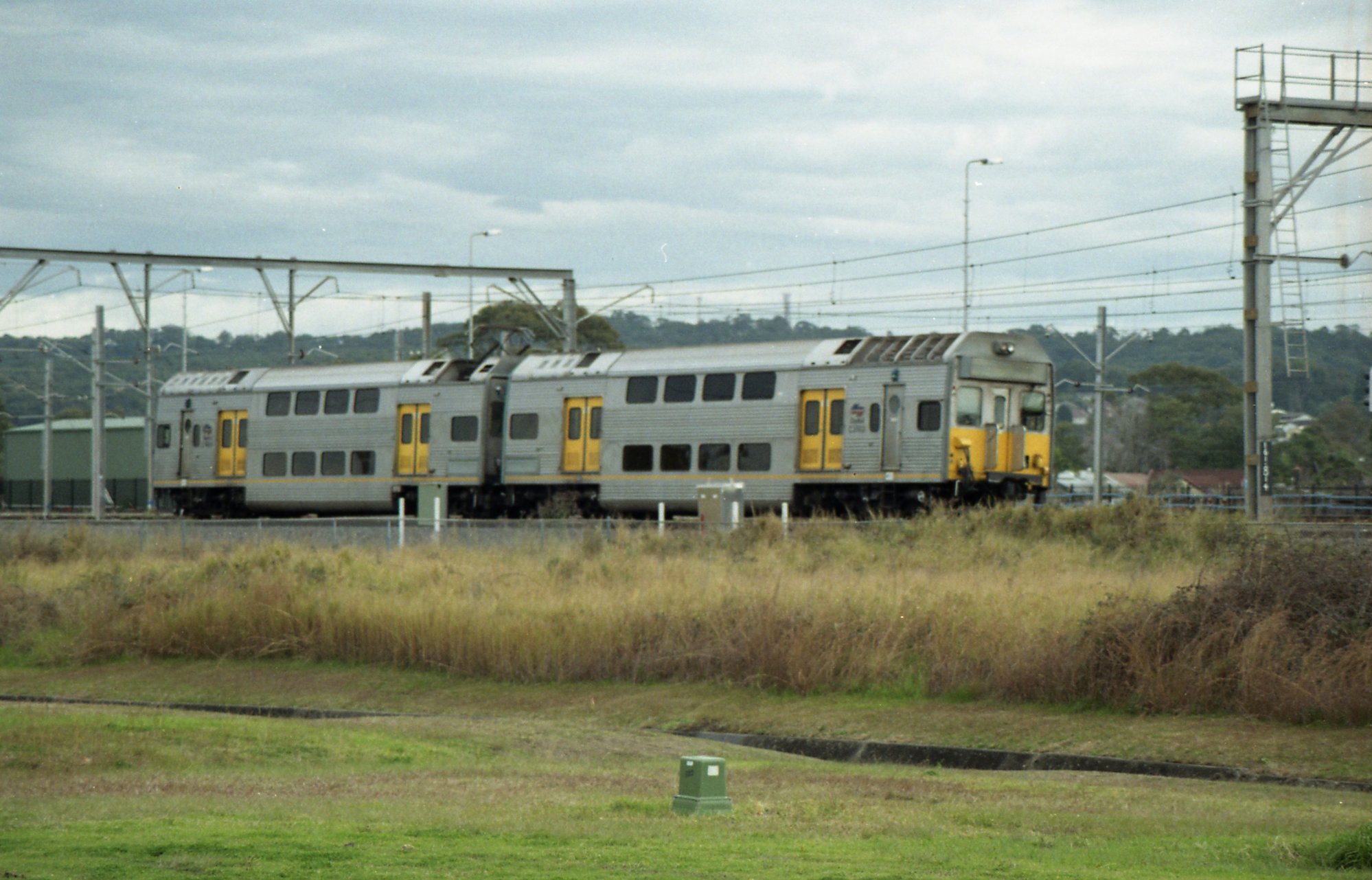 A two car K set passes Broadmeadow Yard on its way to Newcastle ...