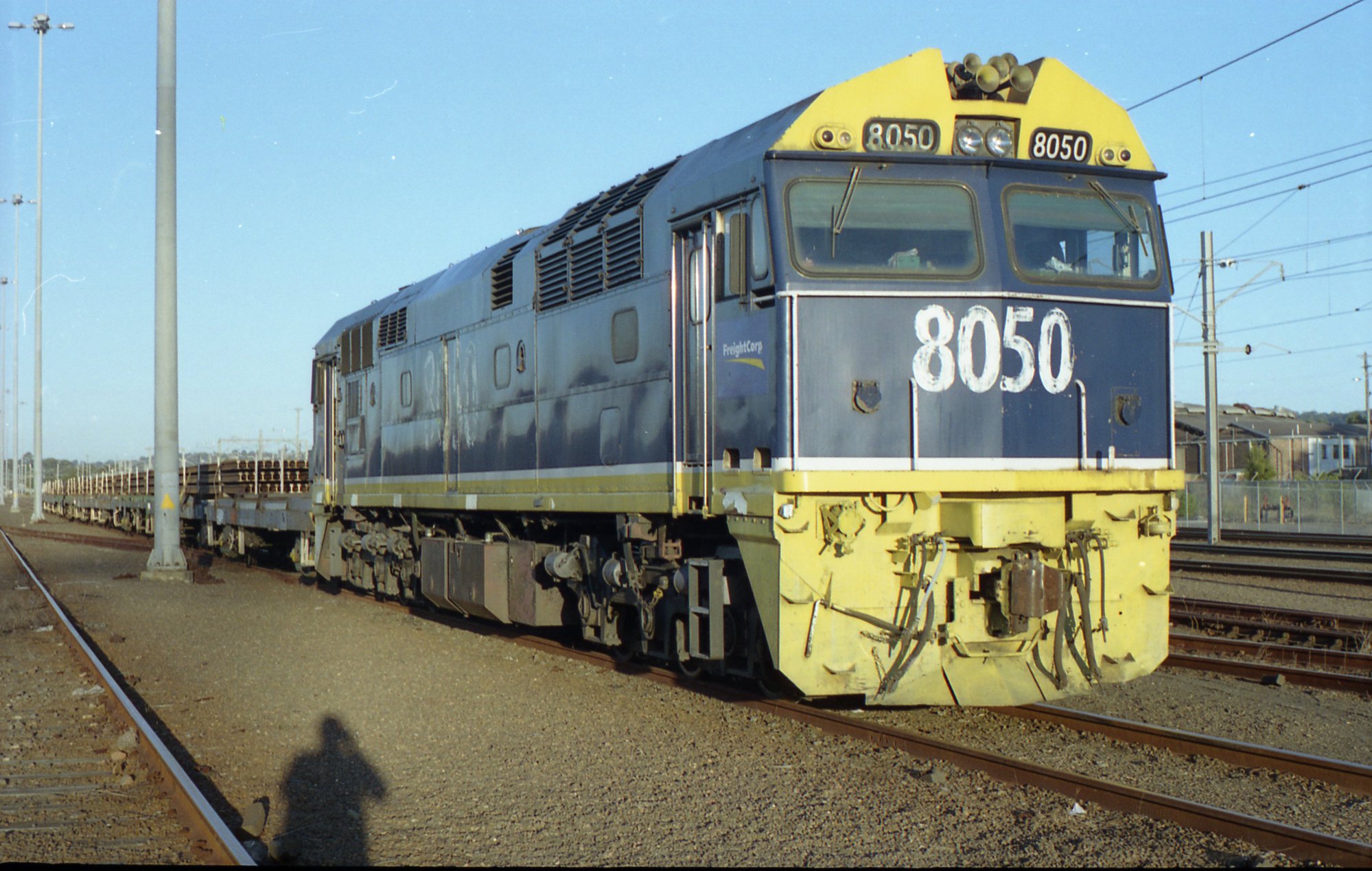 8050 on a string of loaded rail flat wagons at Broadmeadow Yard ...