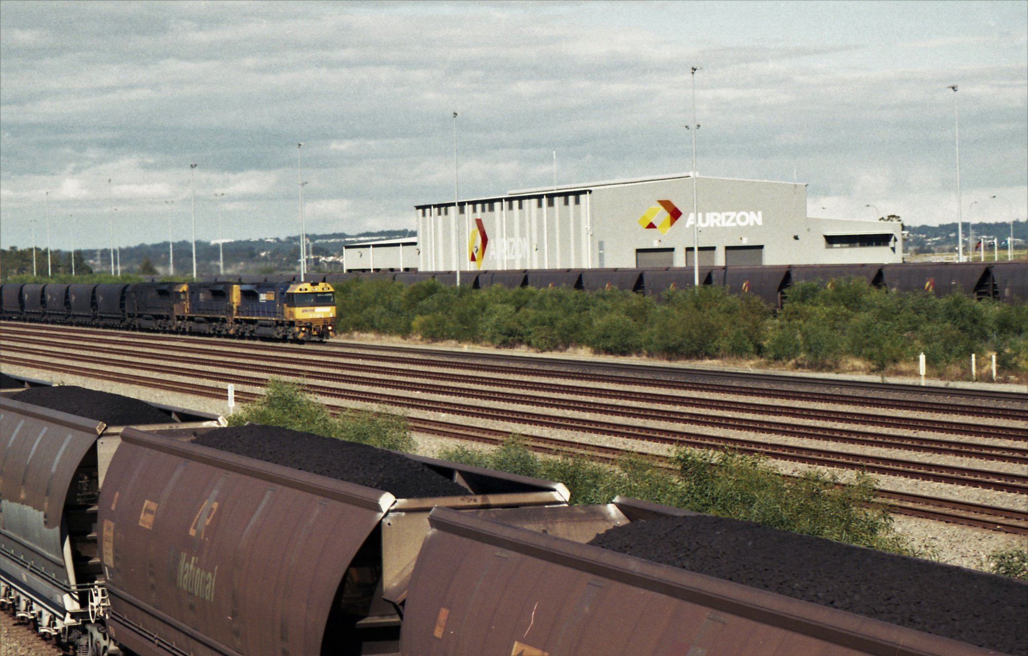 Three TT class locomotives on a Pacific National coal train seen ...