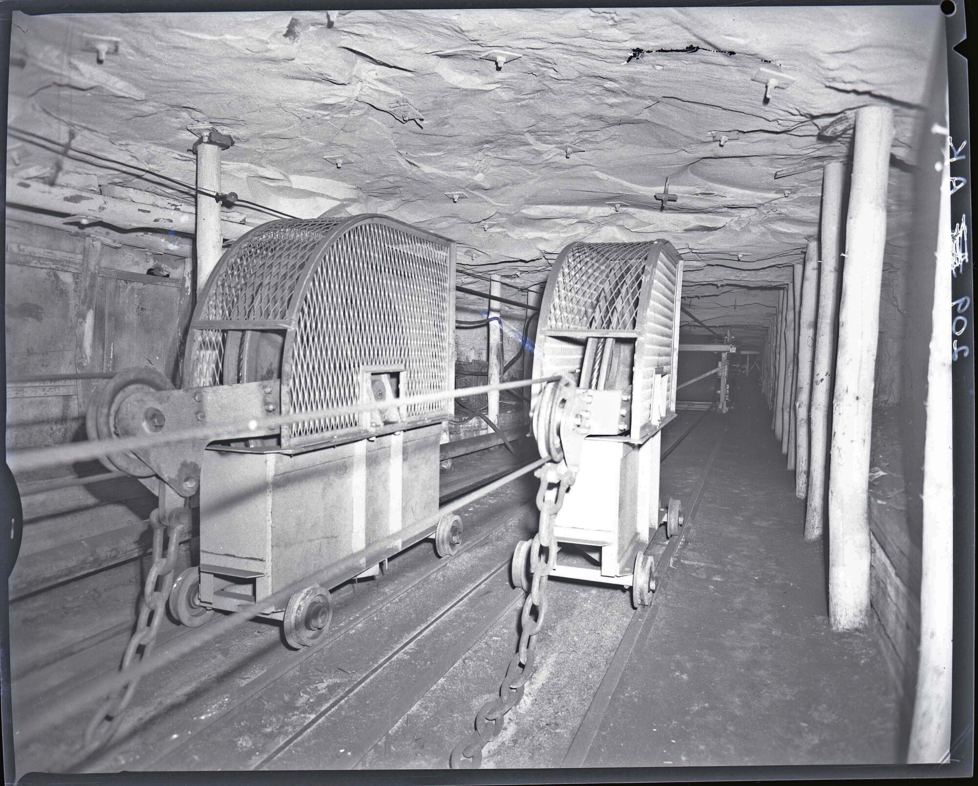 Coalcliff Colliery, two wire pulleys on tracks underground, NSW, 1959 ...