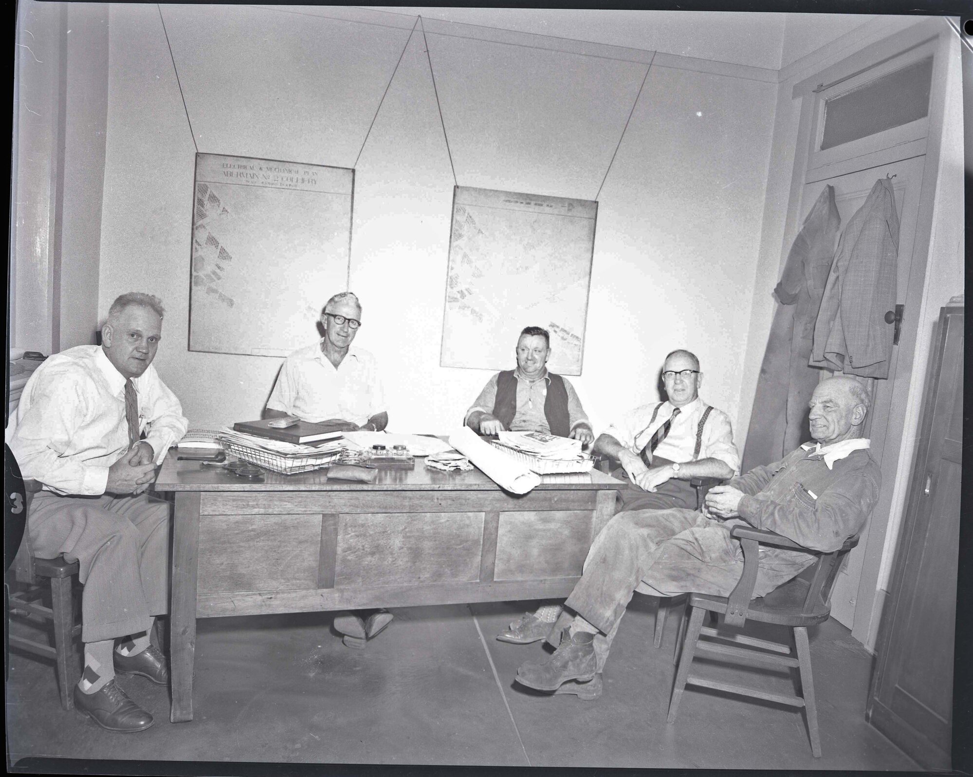 Five men sitting around desk [Abermain Colliery], NSW, 1959 | Living ...