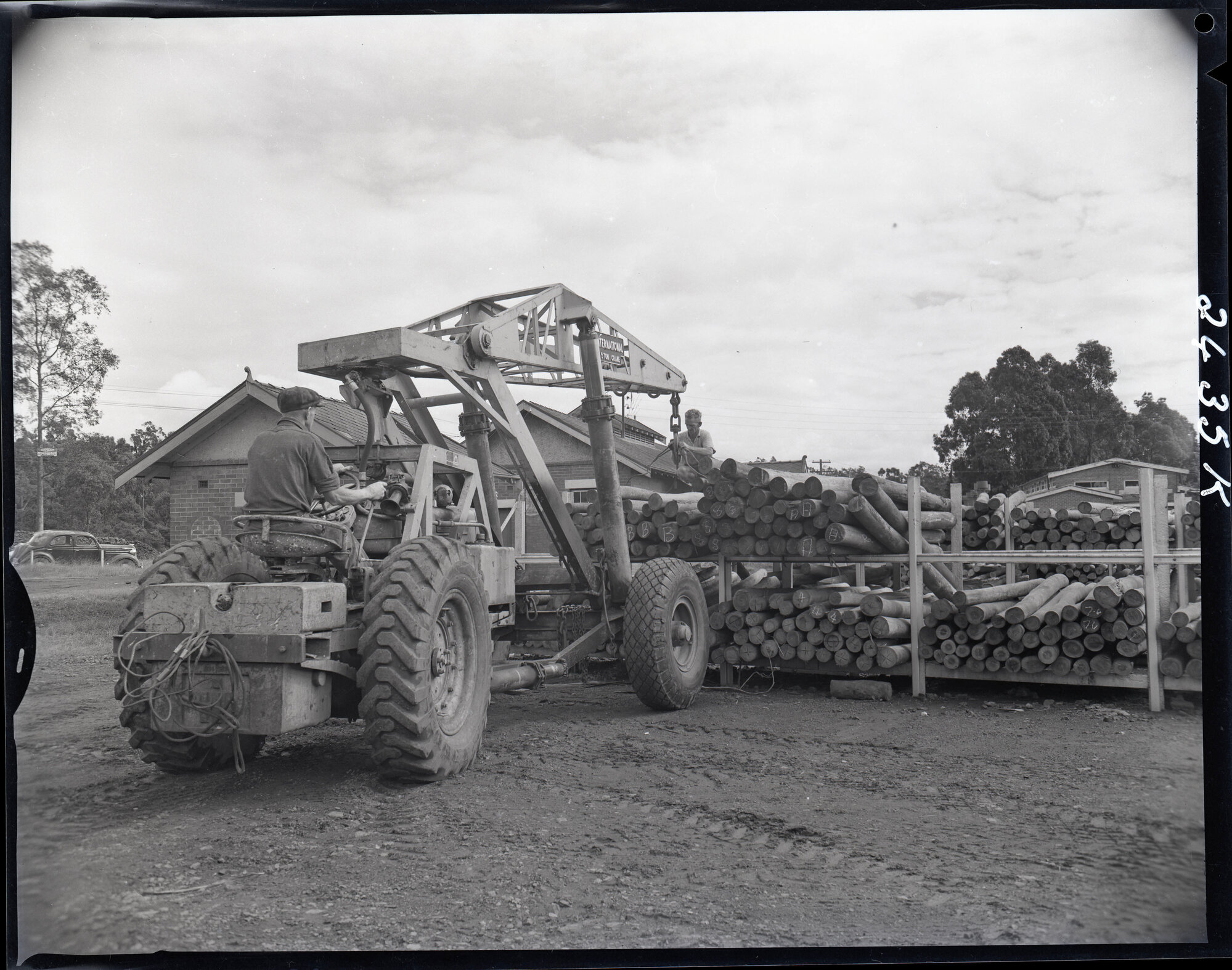[Wyee State Mine], two men moving pit props at with a loader, NSW, 1962 ...